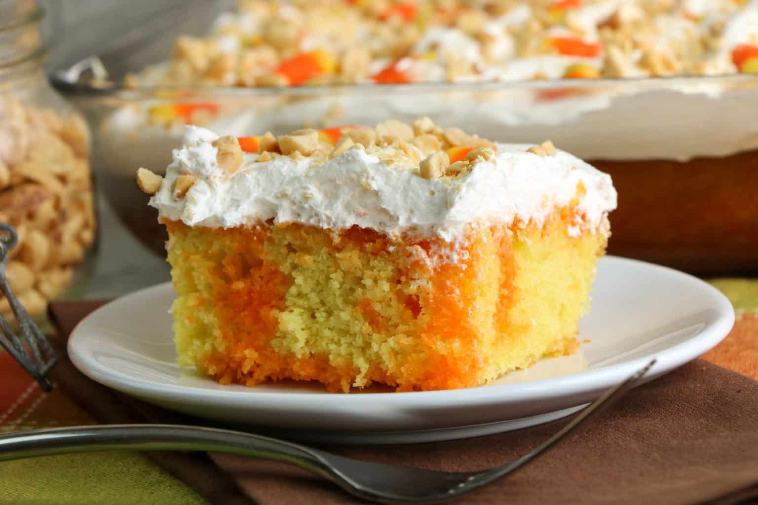 Candy Corn Poke Cake - Mama's On A Budget Fun Fall Dessert